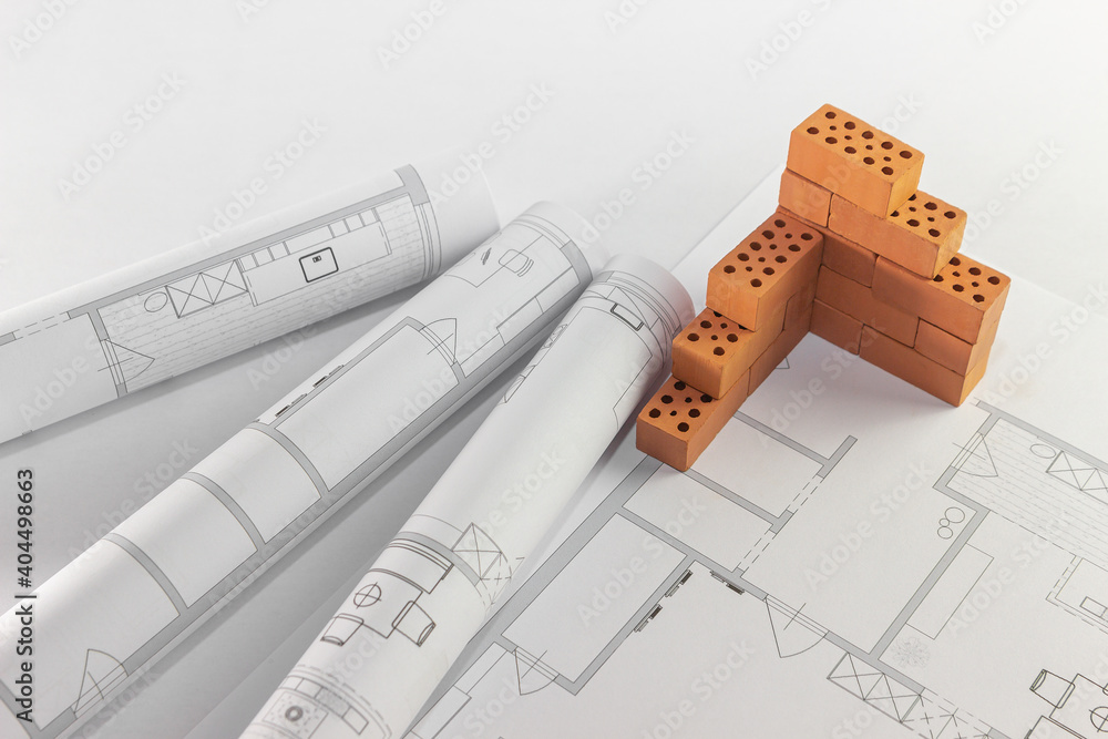 building house - bricks and project for construction industry concept ...