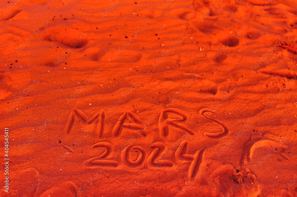 The handwritten lettering Mars 2024 is written in red sand. The concept ...