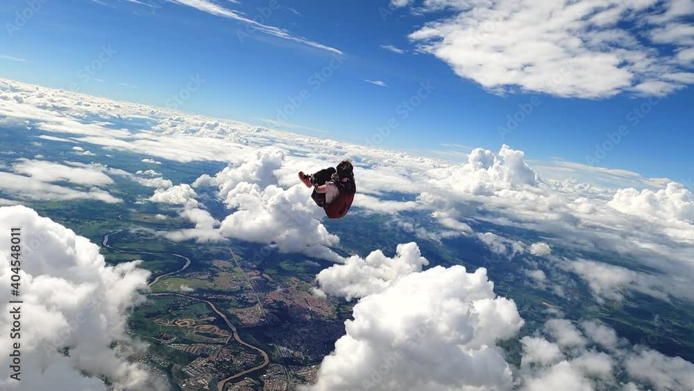 Video of a young woman skydiver jumping from the plane performing front ...