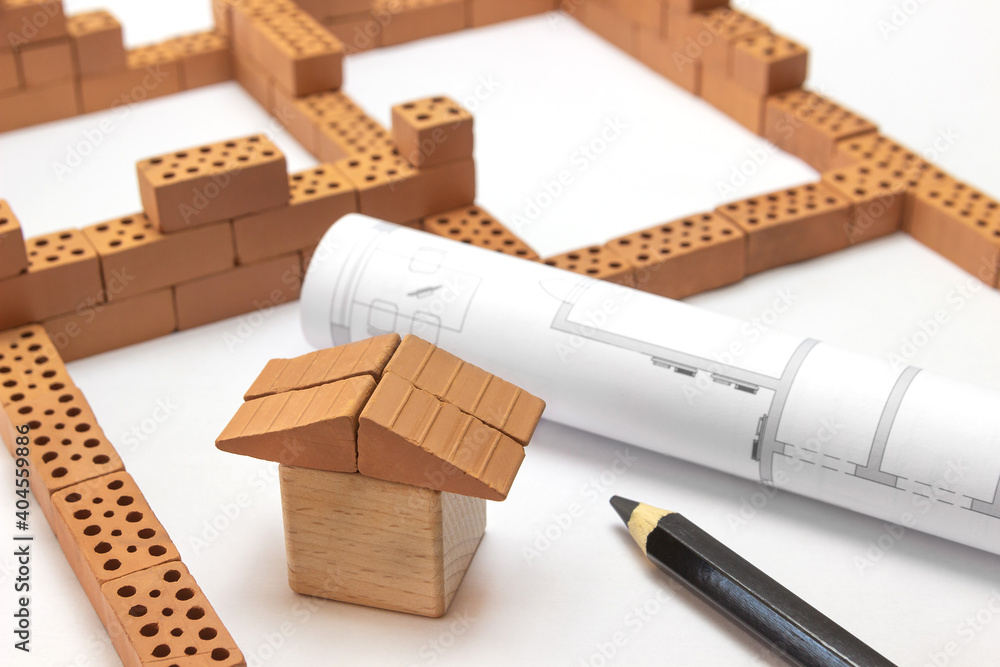 building house - bricks and project for construction industry concept ...