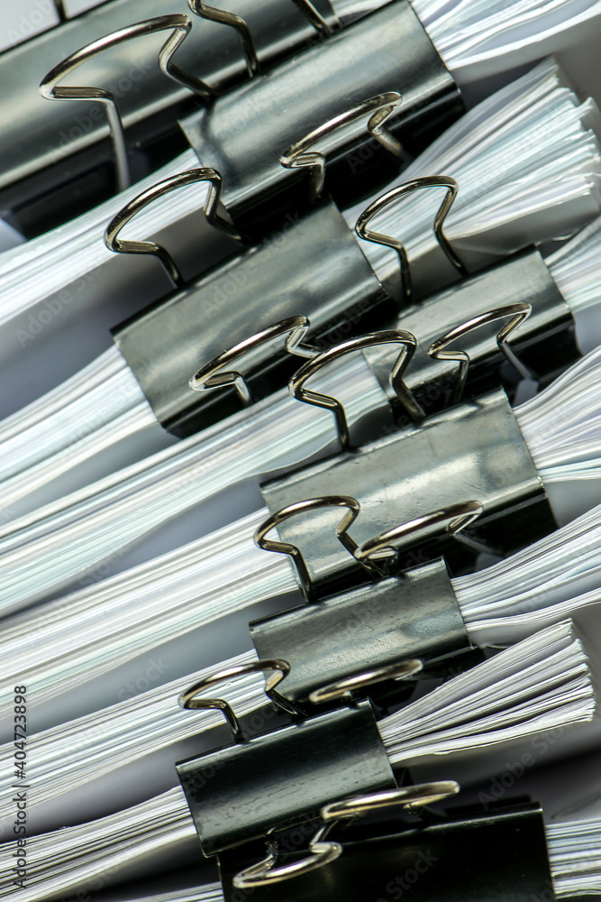 bundles bales of paper documents. stacks packs pile on the desk in the ...