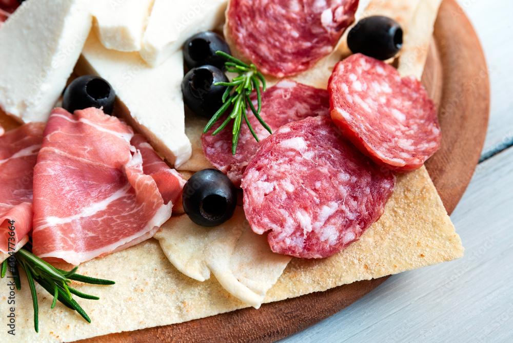 Tagliere di salumi e formaggi tipici italiani Stock Photo | Adobe Stock