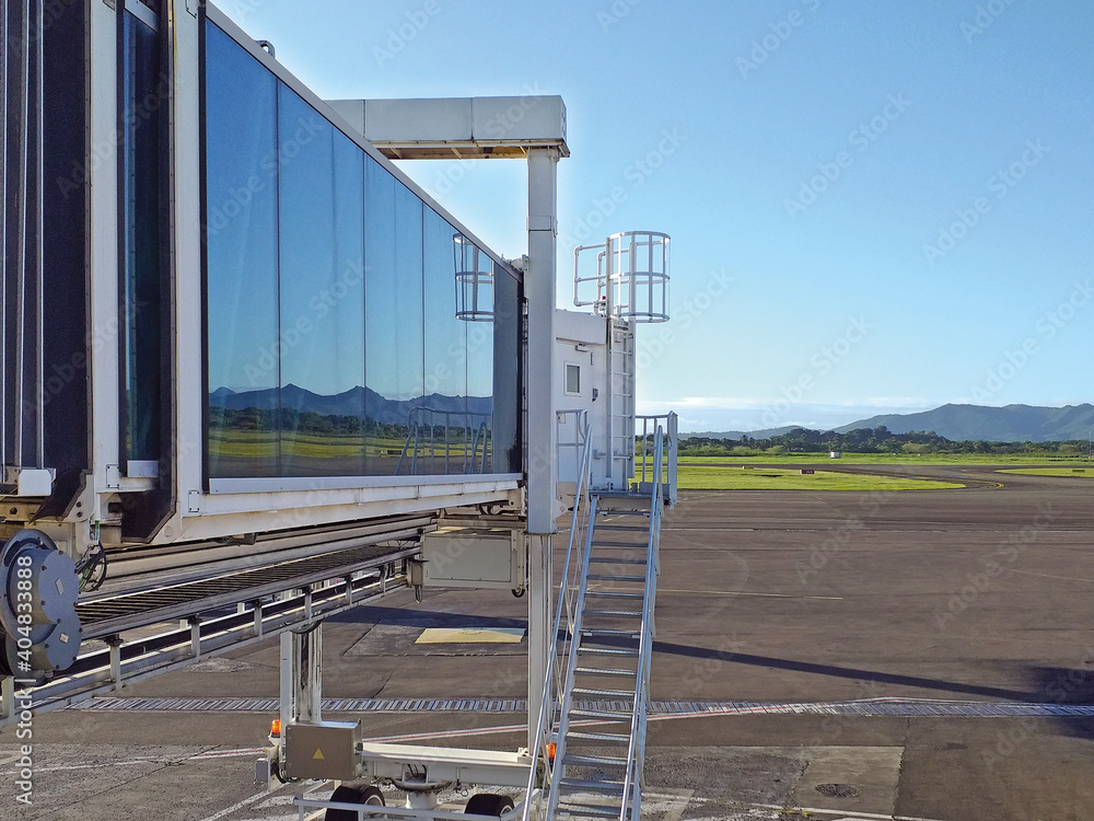 Exterior of passenger boarding bridge. Aircraft access walkway with ...