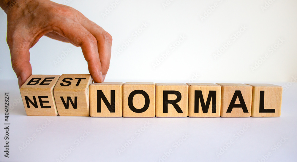 New best normal symbol. Hand turns cubes and changes words 'new normal ...