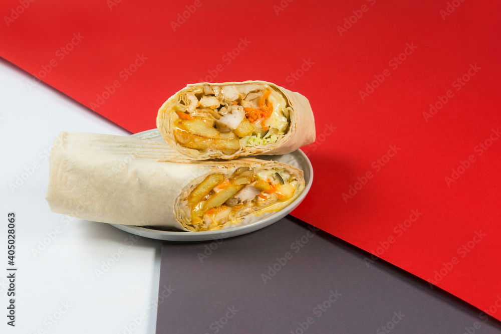 Side view of Chicken meat cheesy Shawarma roll with cabbage, carrot ...