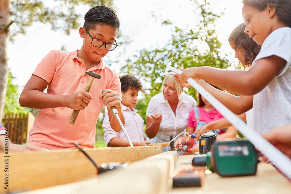 Child with chisel tool while chiseling wood Stock Photo | Adobe Stock