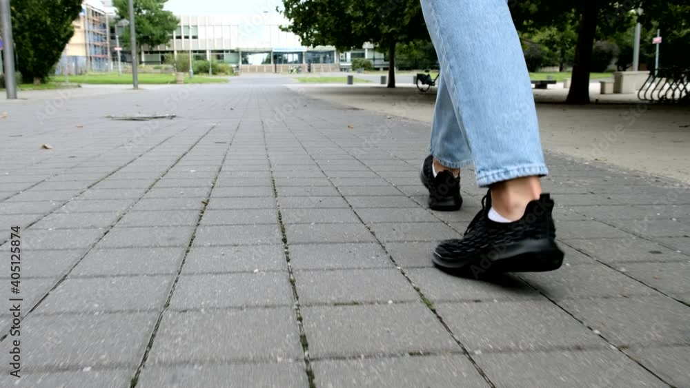 stepping Person. Student legs walking around the city wear in blue ...