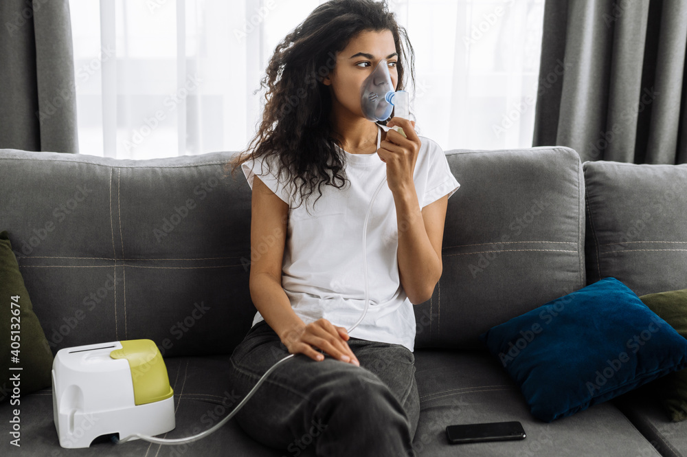 Sick african american woman with an inhaler. Unhealthy african american ...