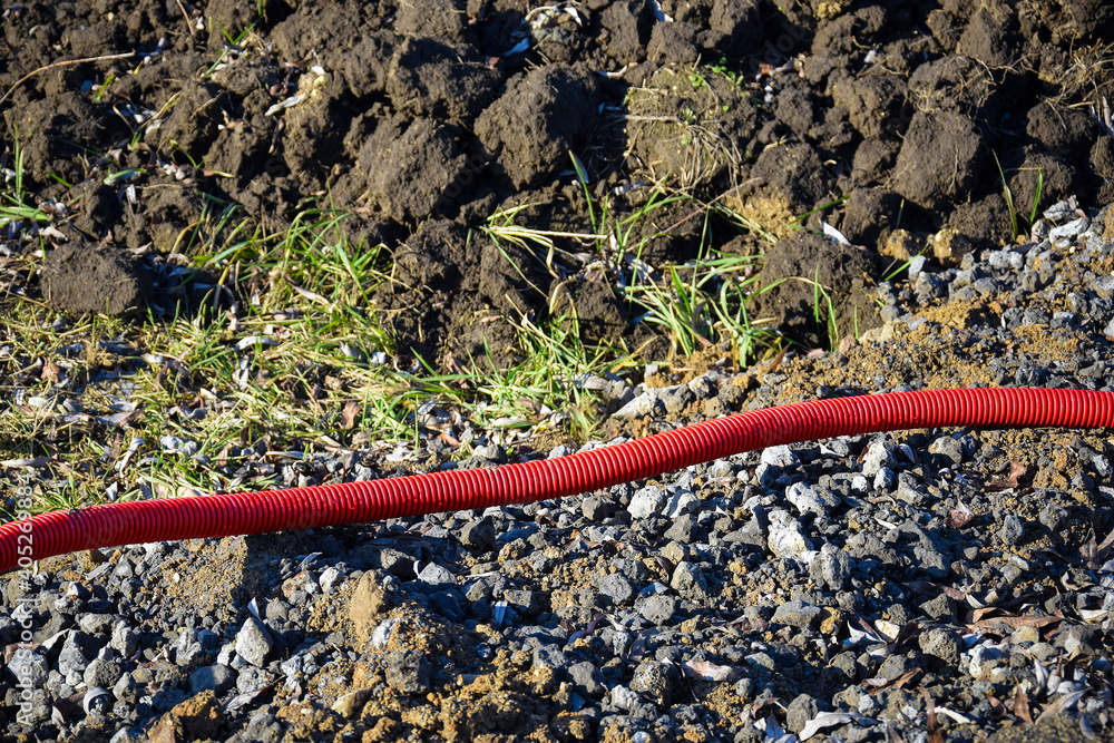 Fotka „Red flexible double-walled pipe for cable ducts. Corrugated ...