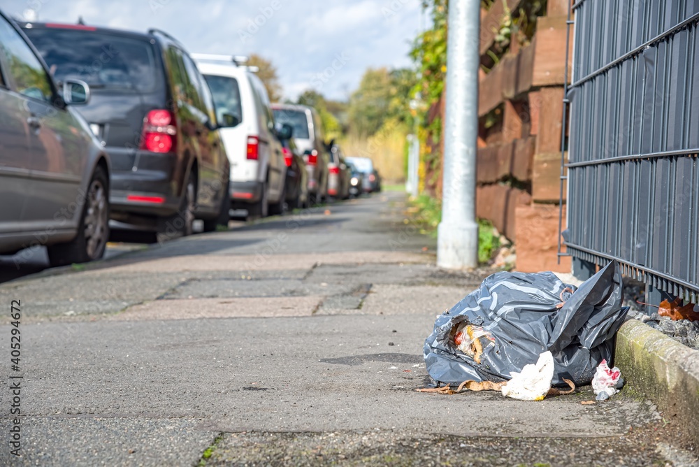 garbage bag on a city street , garbage containers on city streets ...
