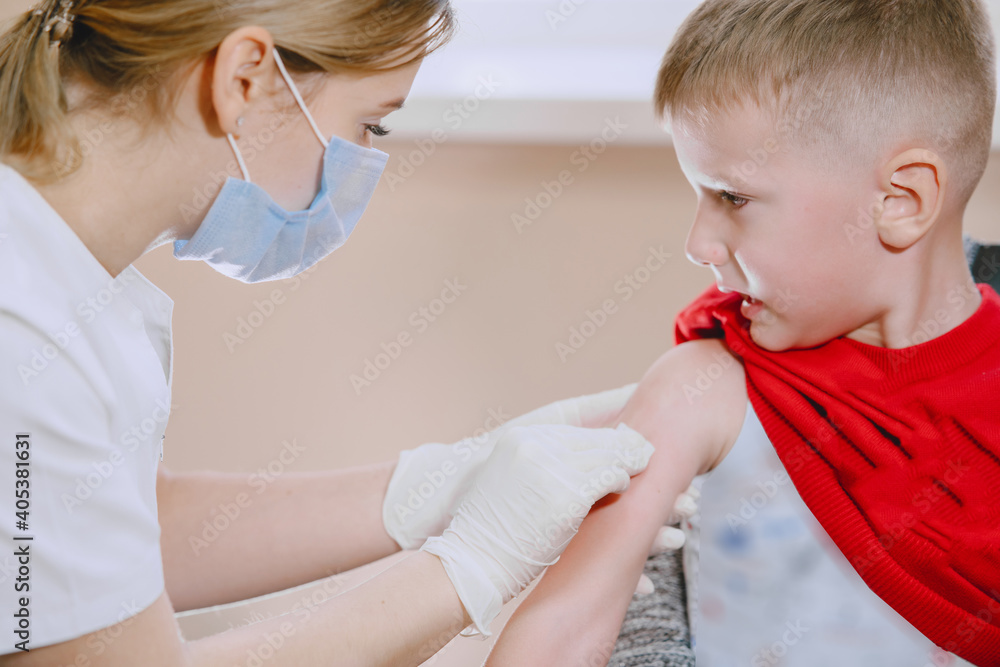 Little child medical visit. Doctor giving a child injection in arm ...