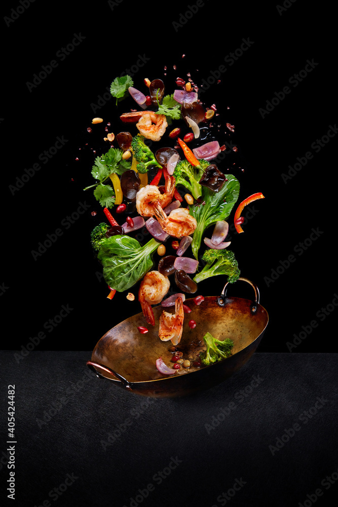Flying wok ingredients - shrimp, vegetables, pak choi leaves, onions ...