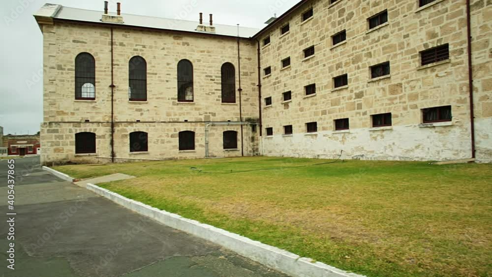 courtyard with barbed wire of Fremantle Prison historic building ...
