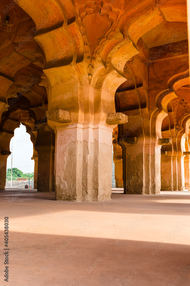 Ornamental granite columns at Lotus Temple complex in desert valley of ...
