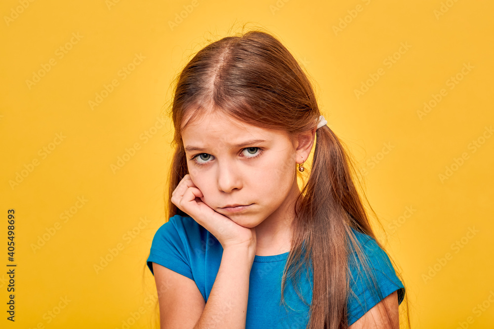 Beautiful girl has a toothache and she is very upset and holding her ...