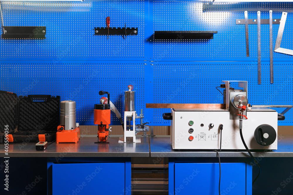 Work table with tools for making connections and crimping electrical ...