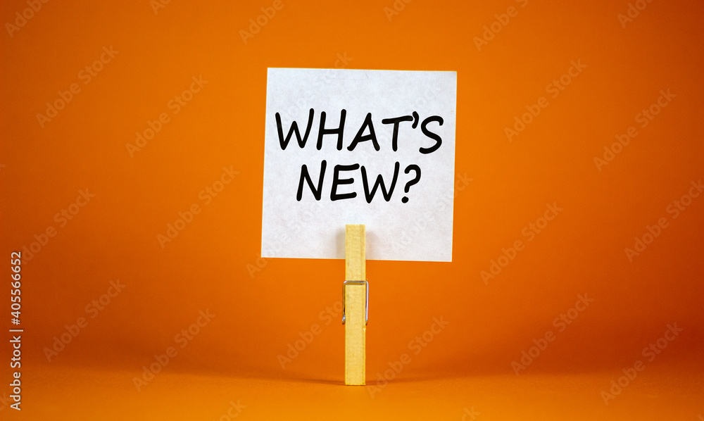 What is new symbol. White sheet of paper on wooden clothespin. Words ...