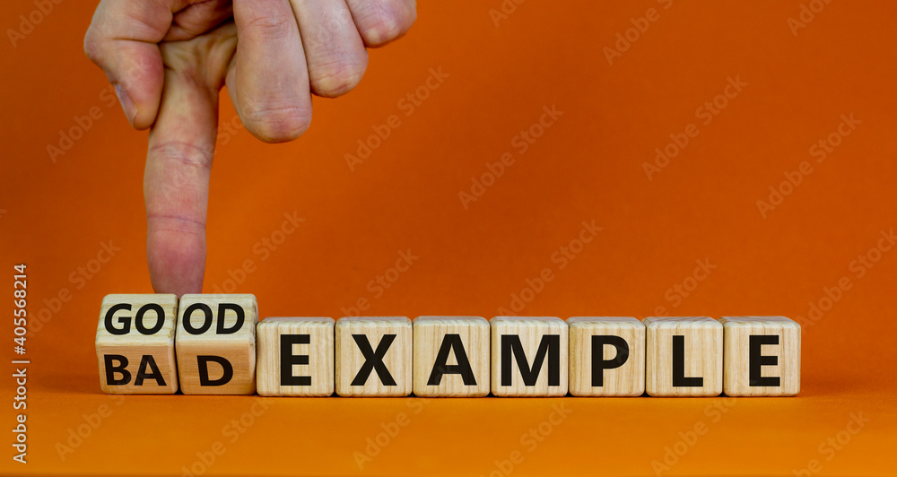 Good or bad example symbol. Businessman turns wooden cubes and changes ...