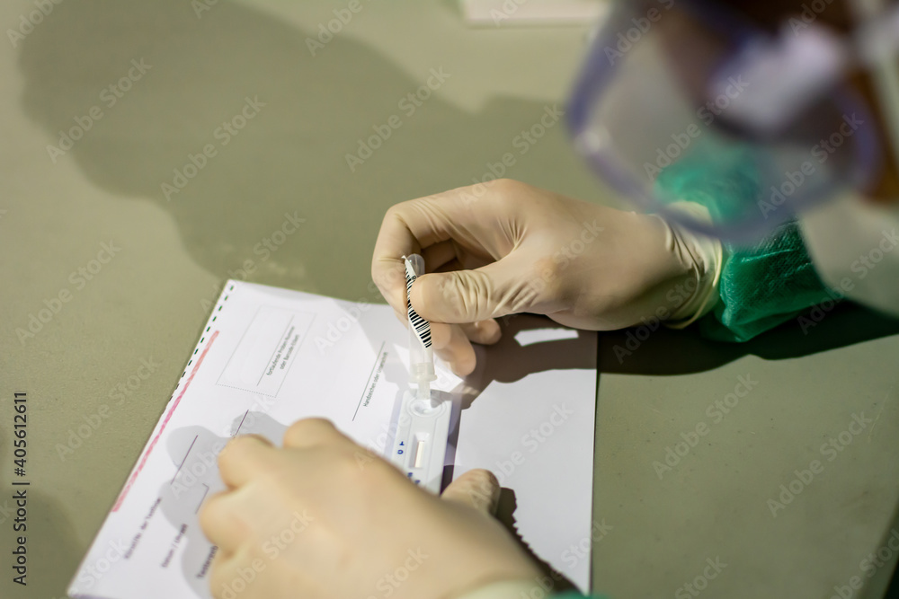 The medical worker conducting a Coronavirus COVID-19 NP OP swab sample ...