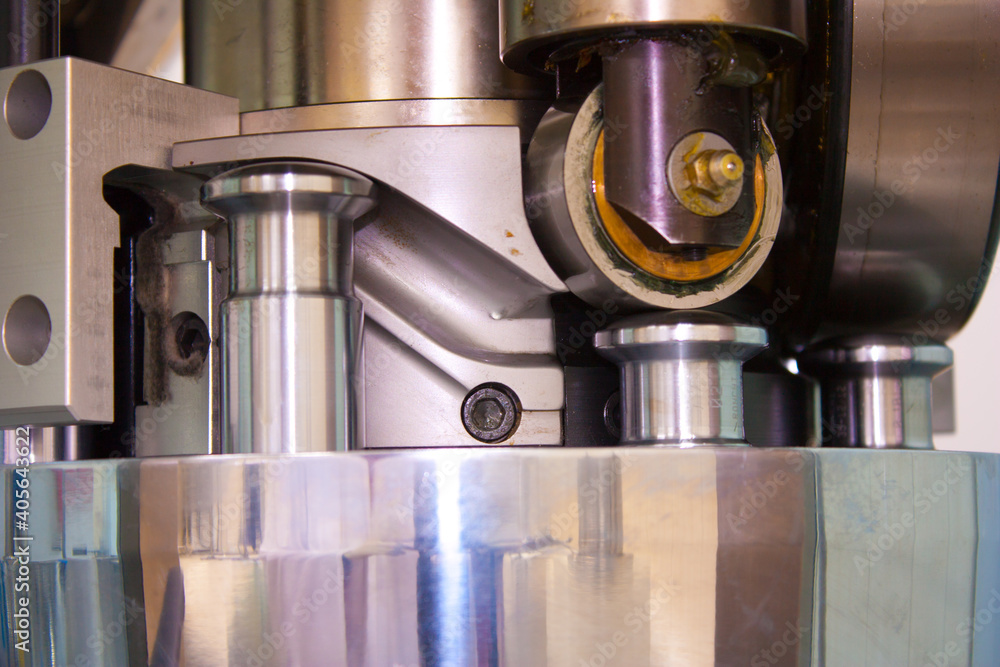 Movement of the punch along the guide chute of the rotary tablet press ...