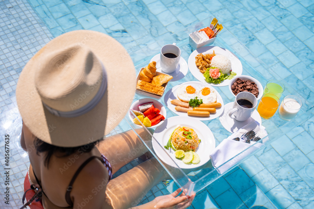 luxury floating breakfast eat in swimming pool Stock Photo | Adobe Stock