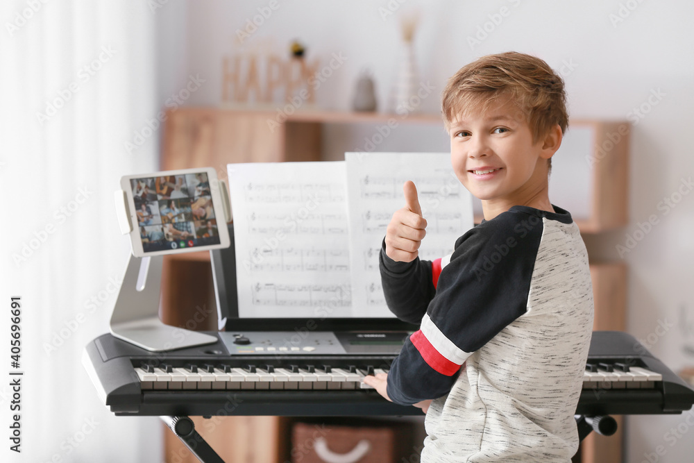Little boy taking music lessons online at home Stock Photo | Adobe Stock