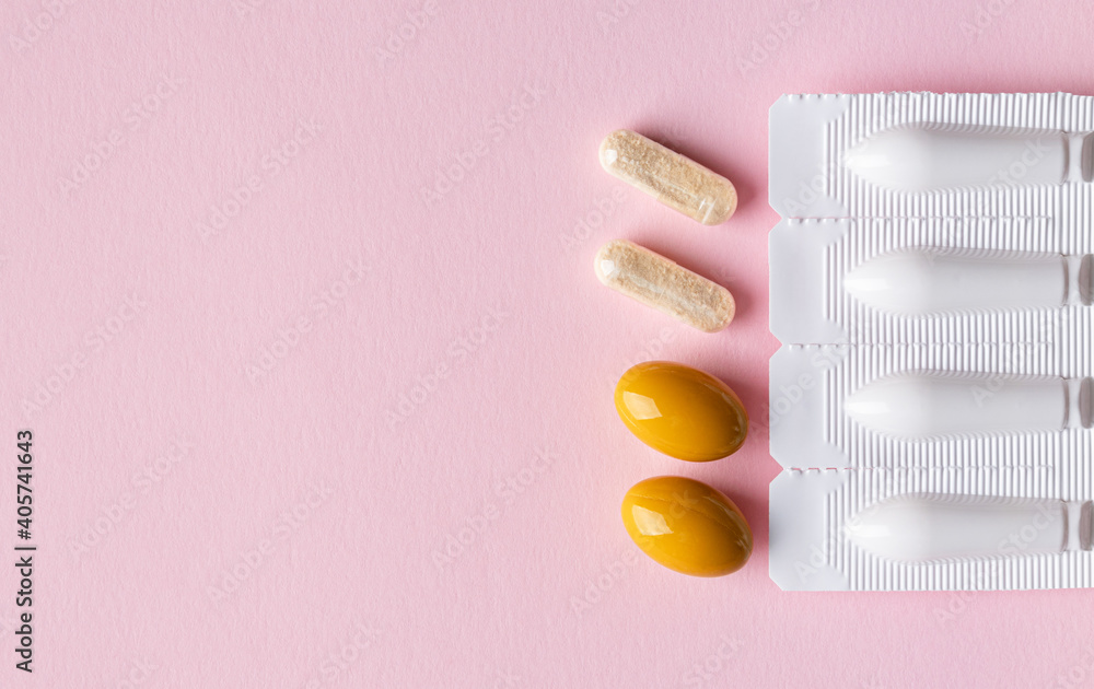Vaginal suppositories on pink background. Top view. Copy space ...