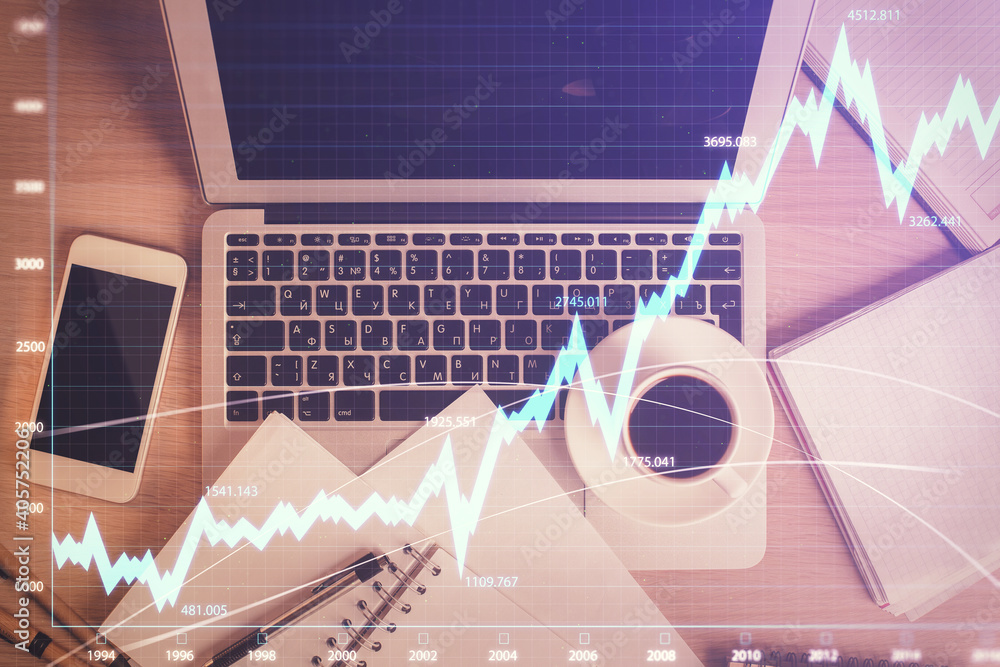 Stock market chart and top view computer on the table background ...