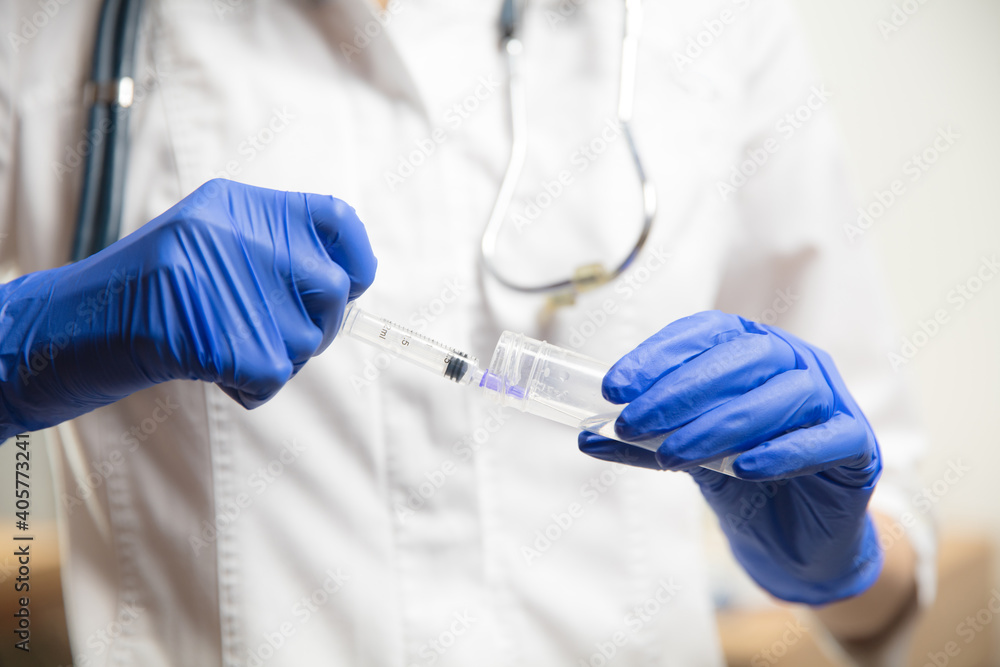 Doctor or nurse giving vaccine to patient using the syringe injected in ...