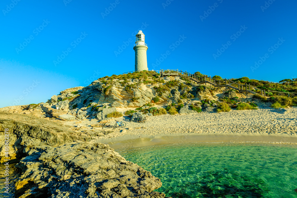 Pinky Beach and Bathurst Lighthouse on background. Turquoise sea and ...
