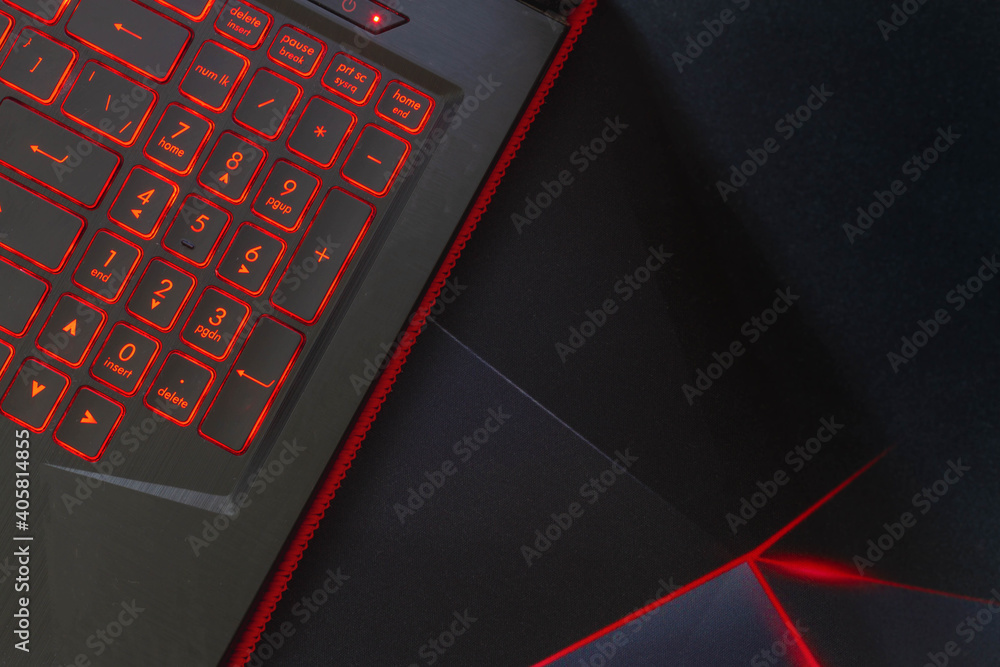 Laptop keyboard on a black background. The keys glow red. Stock Photo ...