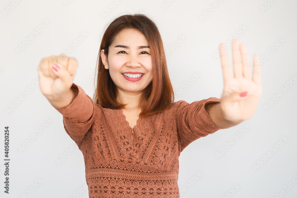 happy Asian making hand gesture showing her fingers age 40s year old ...