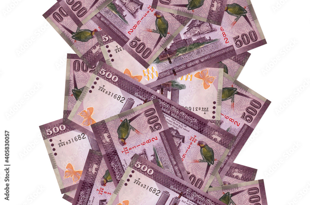 500 Sri Lankan rupees bills flying down isolated on white. Many ...