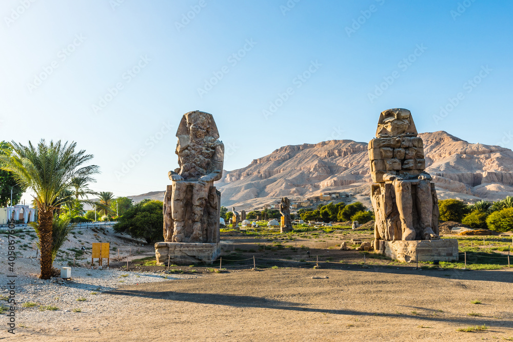 The Colossi of Memnon, two massive stone statues of the Pharaoh ...