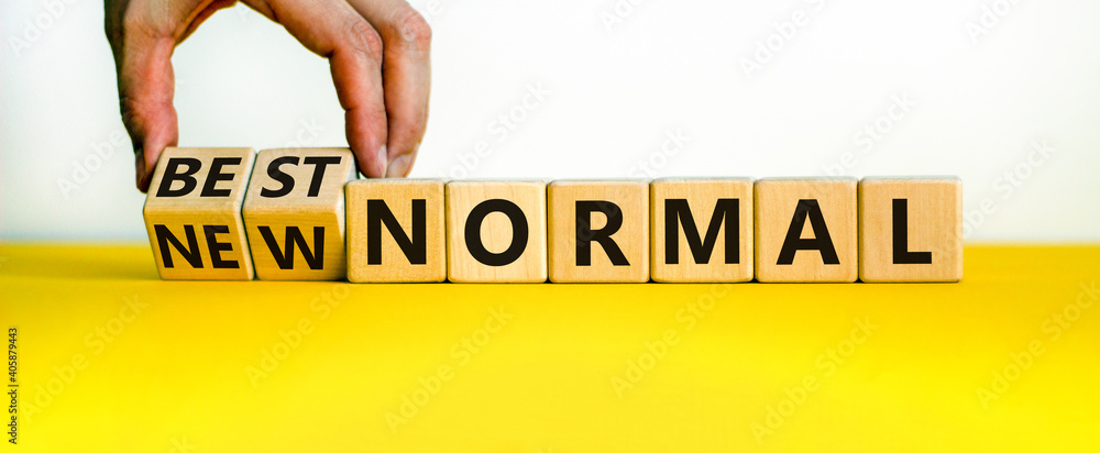 New best normal symbol. Hand turns cubes and changes words 'new normal ...