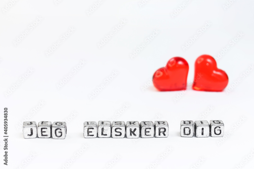 Jeg elsker dig inscription made on metal cube beads with letters. Close ...