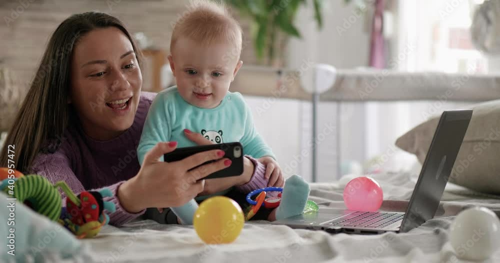 Authentic close up of mother and her baby of video call to father. The ...