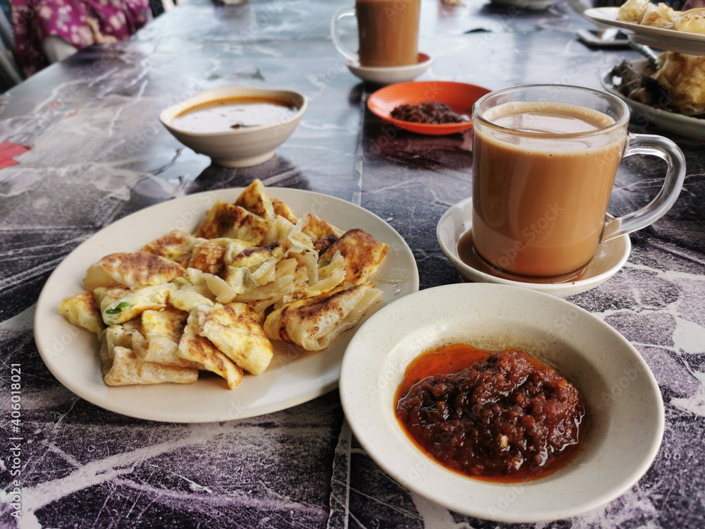 Roti canai and teh tarik. The popular breakfast menu people in malaysia ...