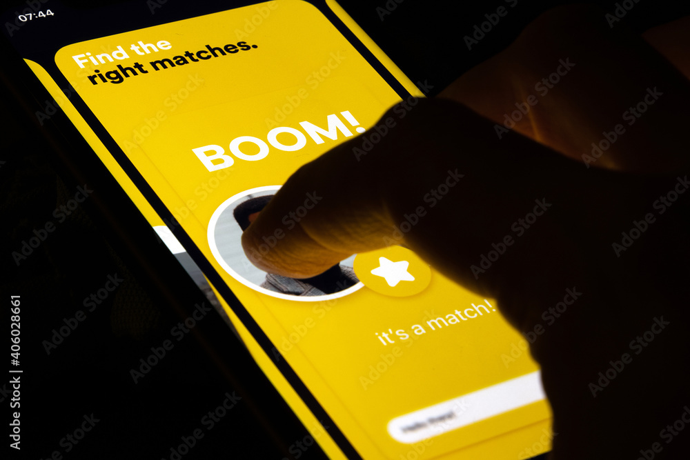 Hand holding a smartphone with a Bumble dating app on apple store at ...