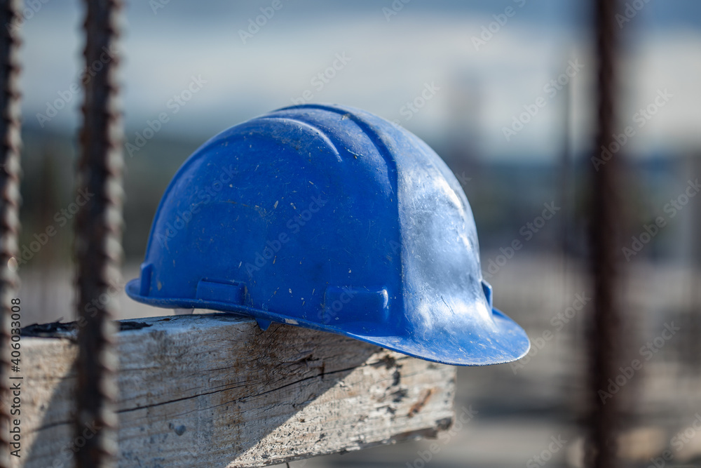 Blue construction safety helmet at a construction site Stock Photo ...