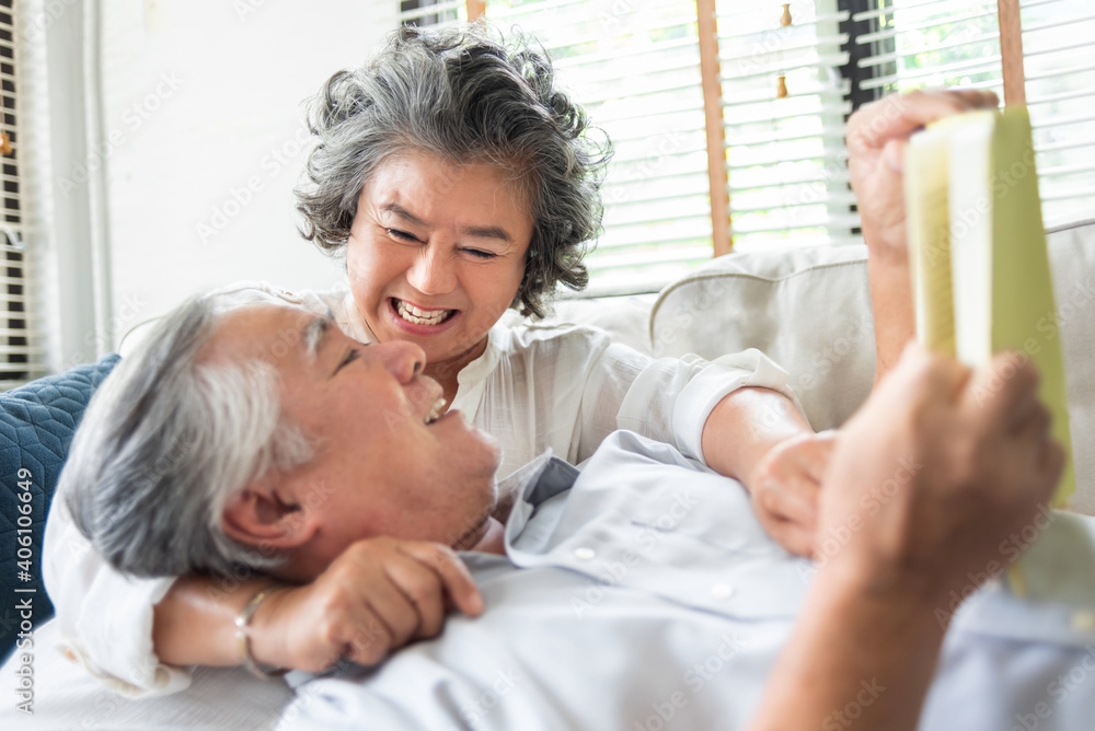 Foto de Happy Asian senior couple in love hugging and laughing enjoying life and spending time ...