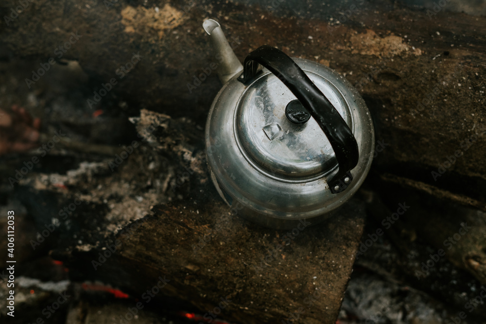 Boiling water in the keetle on the campfire.Bushcraft style camping ...