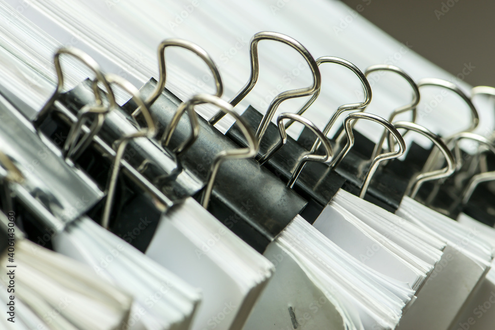 Bundles bales of paper documents. stacks packs pile on the desk in the ...