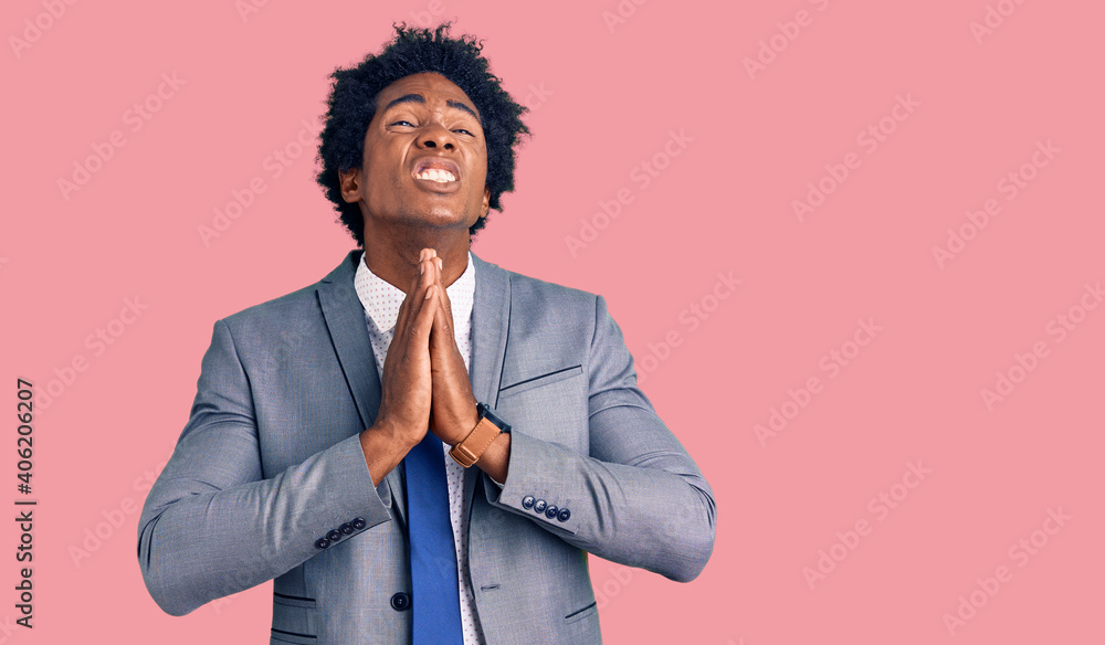 Handsome african american man with afro hair wearing business jacket ...