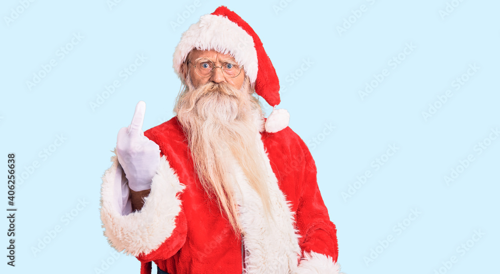 Old senior man with grey hair and long beard wearing traditional santa ...