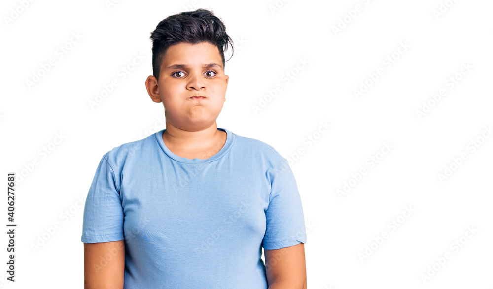Little boy kid wearing sports workout clothes puffing cheeks with funny ...