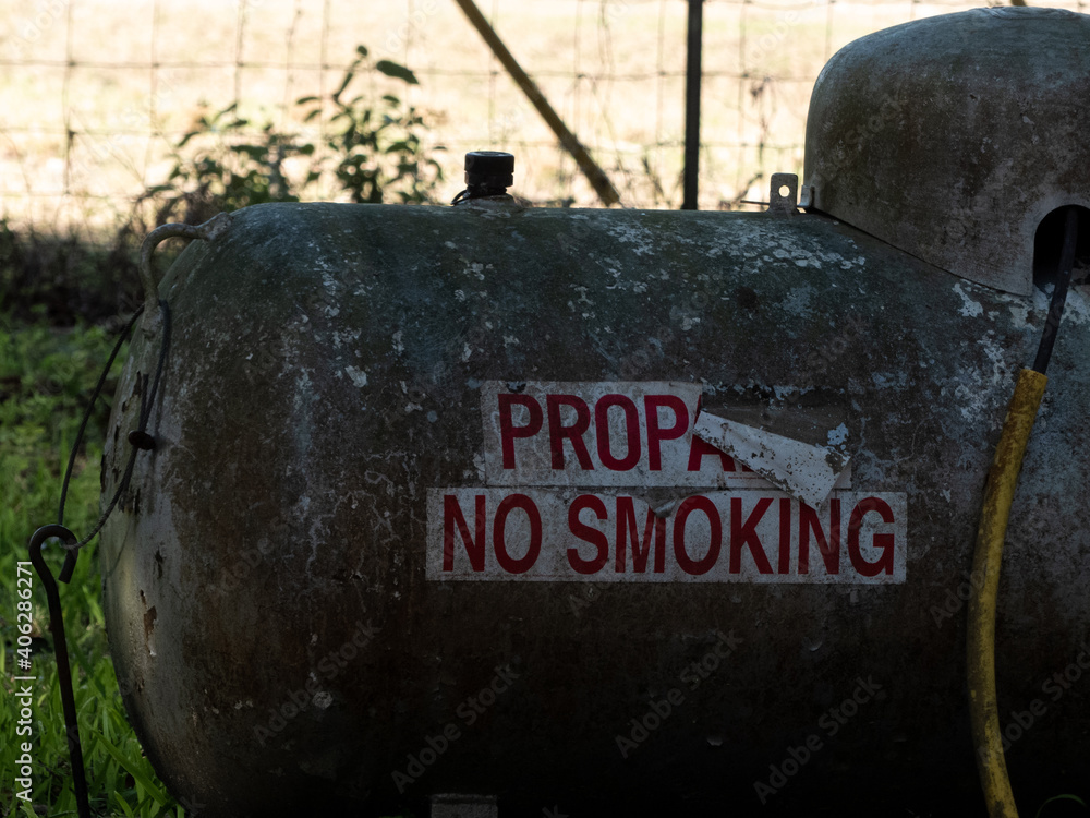 No smoking sign. Propane tank. Old container with moss. Stock Photo ...