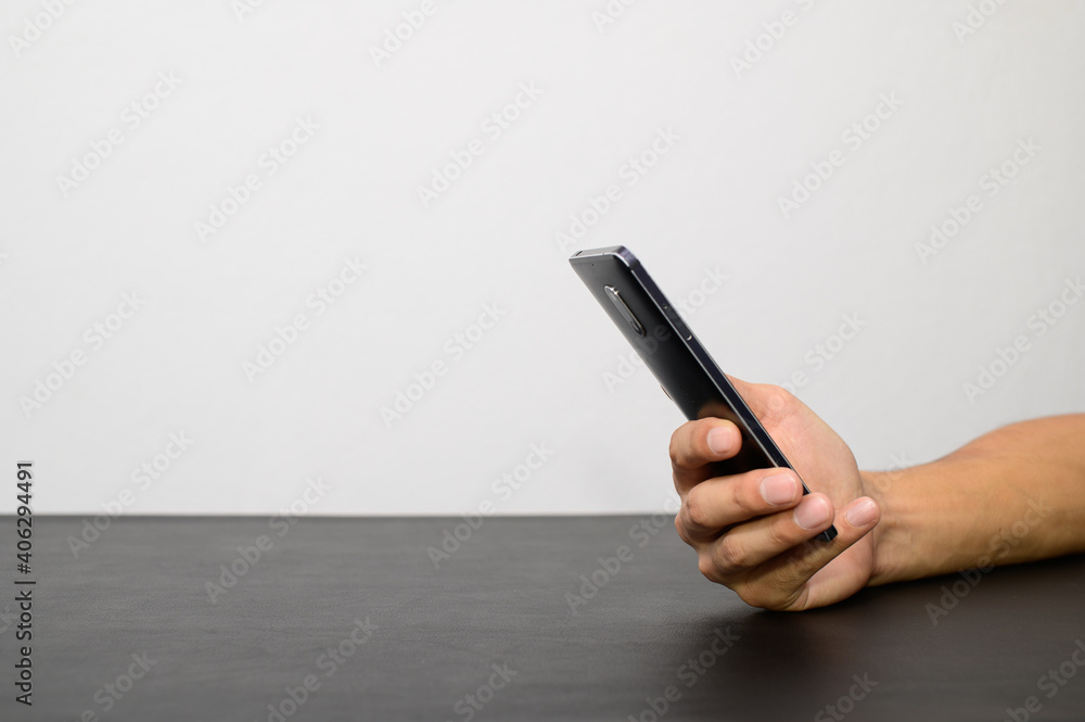 Hold your phone, use your smartphone at your desk Stock Photo | Adobe Stock