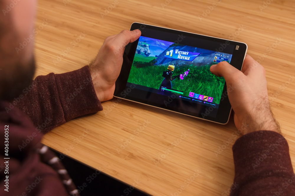 PRAGUE, CZECH REPUBLIC - MARCH 16, 2019: Man holding a smartphone and ...