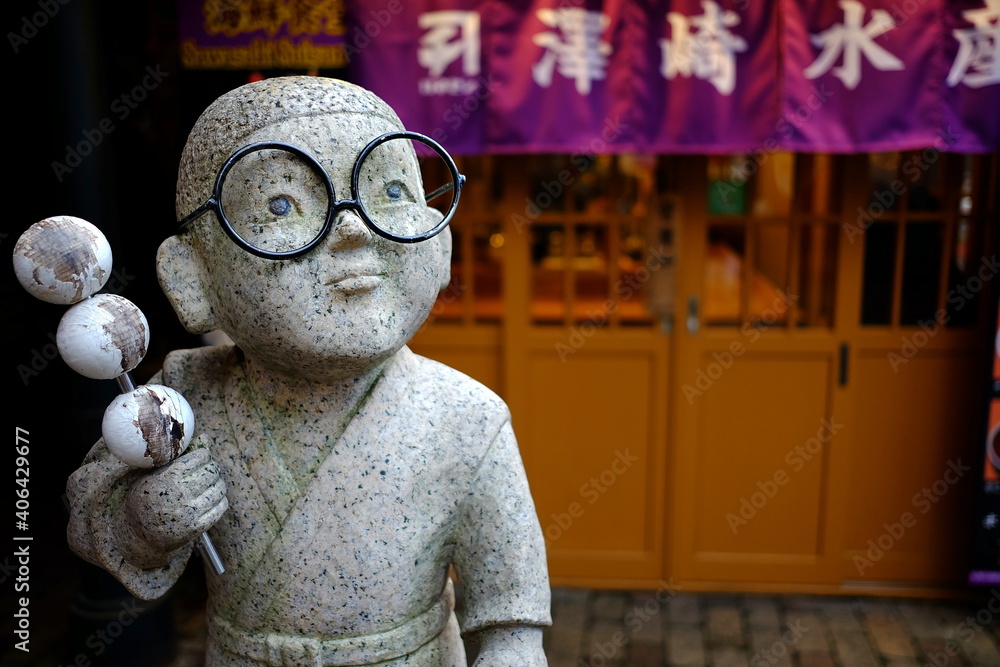 OTARU, JAPAN - NOVEMBER 12, 2019: Close up cute stone boy statue in ...